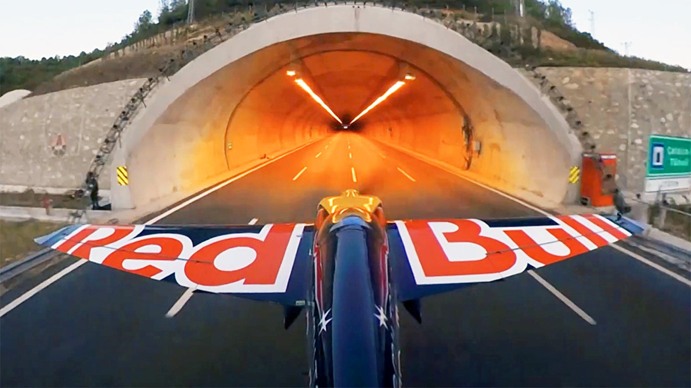 WATCH: Red Bull Stunt Pilot Flies Plane Through A Tunnel - Boss Hunting